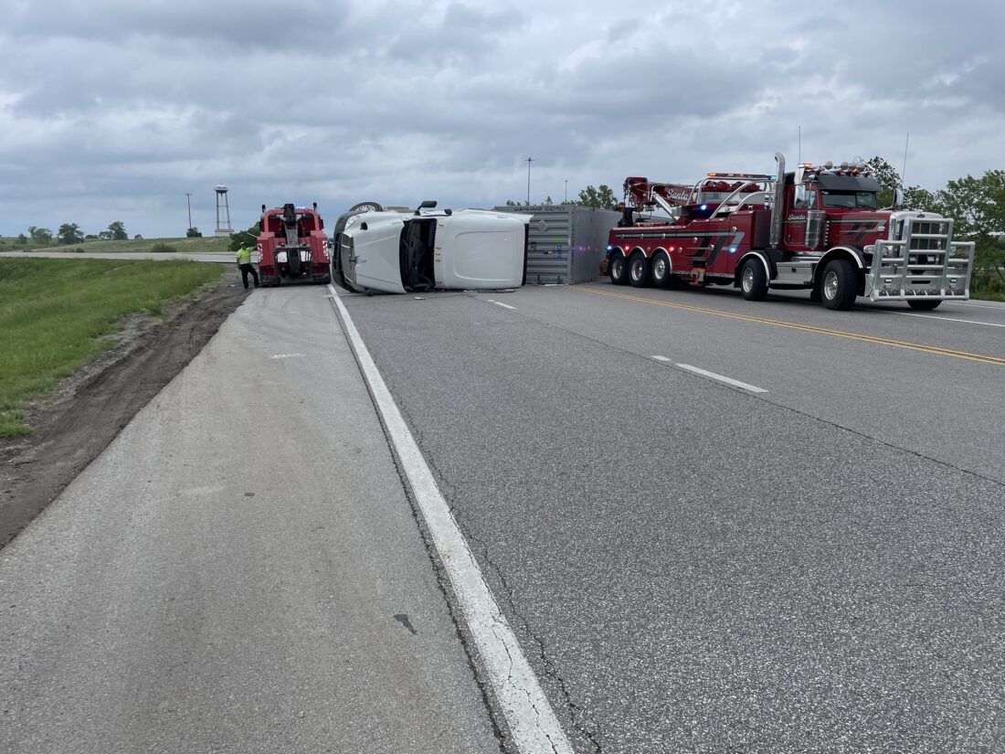 Driver suffers minor injuries after semi-trailer rolls on highway, blocking traffic for several ...